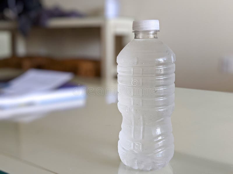 Plastic Water Bottle on Table on Sunny Day Stock Photo - Image of ...