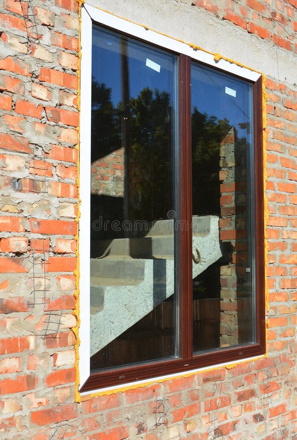 Plastic Window Insulation with Spray Foam Insulation on Construction ...