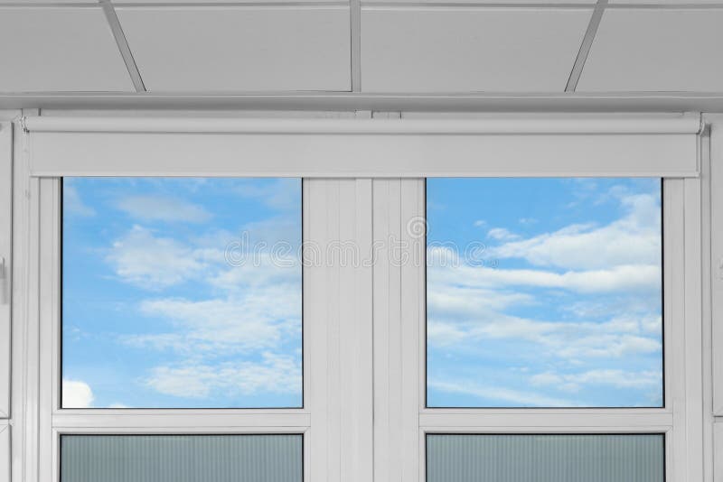 Plastic Windows with White Roller Blinds Indoors Stock Photo - Image of ...