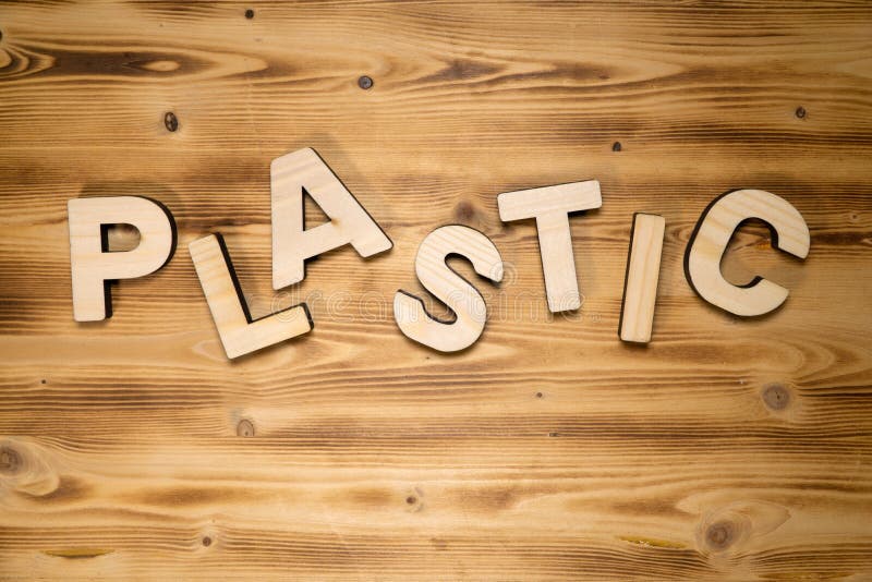 PLASTIC Word Made of Wooden Letters on Wooden Board Stock Photo - Image ...