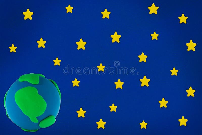 Plasticine Yellow Star and Blue Green Earth on Blue Background Stock ...