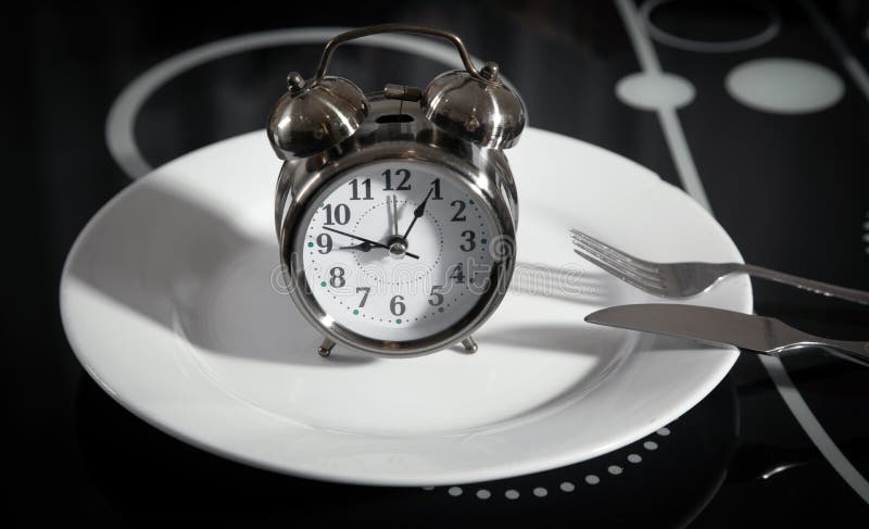 Plate with a Alarm Clock Fork and Knife Stock Photo - Image of ...
