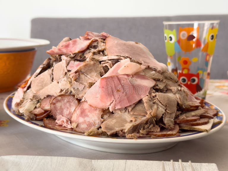 Plate of Assorted Cold Cuts on Dining Table with Colorful Owl Glassware ...