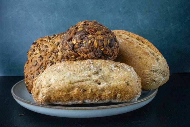 A Plate with Assorted Rustic Bread Rolls Stock Photo - Image of ...