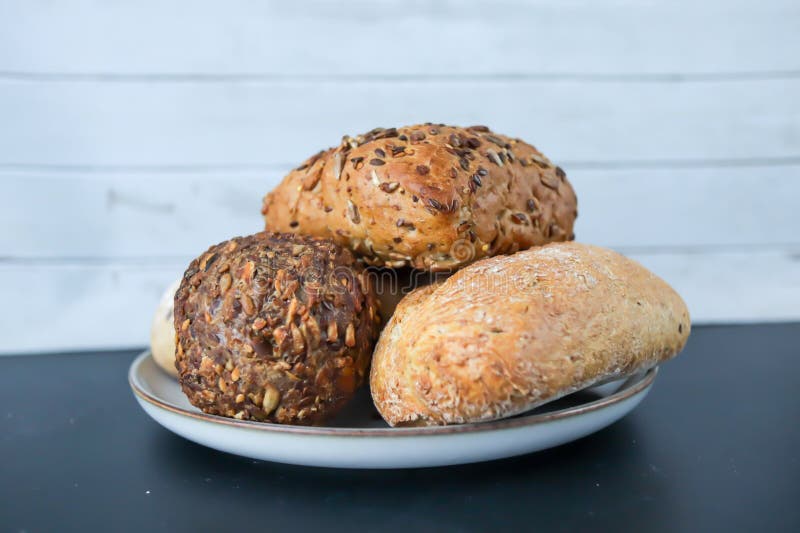 A Plate with Assorted Rustic Bread Rolls Stock Image - Image of crunchy ...