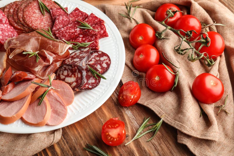 Plate with Assortment of Delicious Deli Meats on Table Stock Image ...