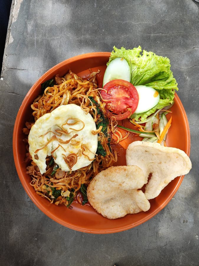 A Plate of an Authentic Fried Noodles in Indonesia with Eggs ...