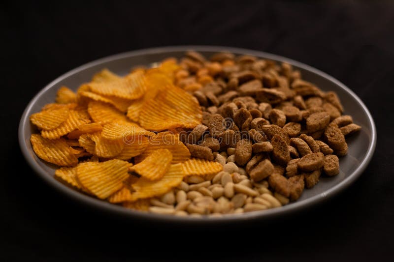 Plate with Beer Snacks on Black Background Stock Photo - Image of ...