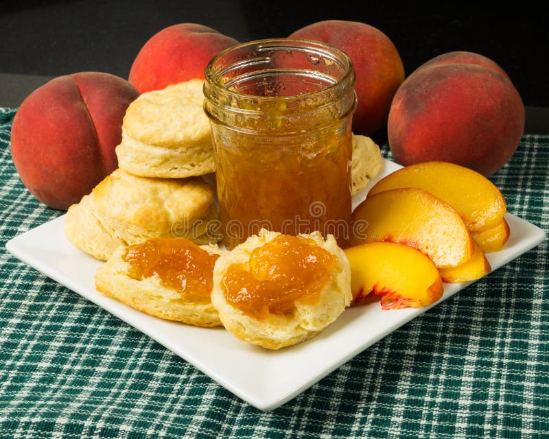 Plate of biscuits with peaches and peach jam, Plate of biscuits with ...
