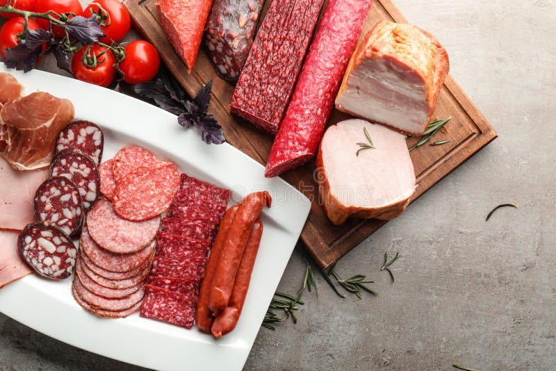 Plate and Board with Assortment of Delicious Deli Meats on Table Stock ...