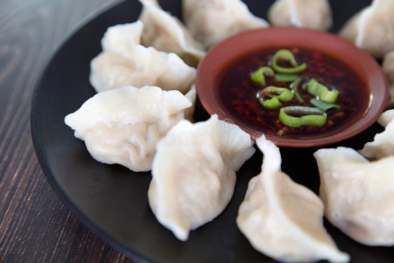 A Plate of Boiled Dumplings and Dip Stock Image - Image of east, market ...