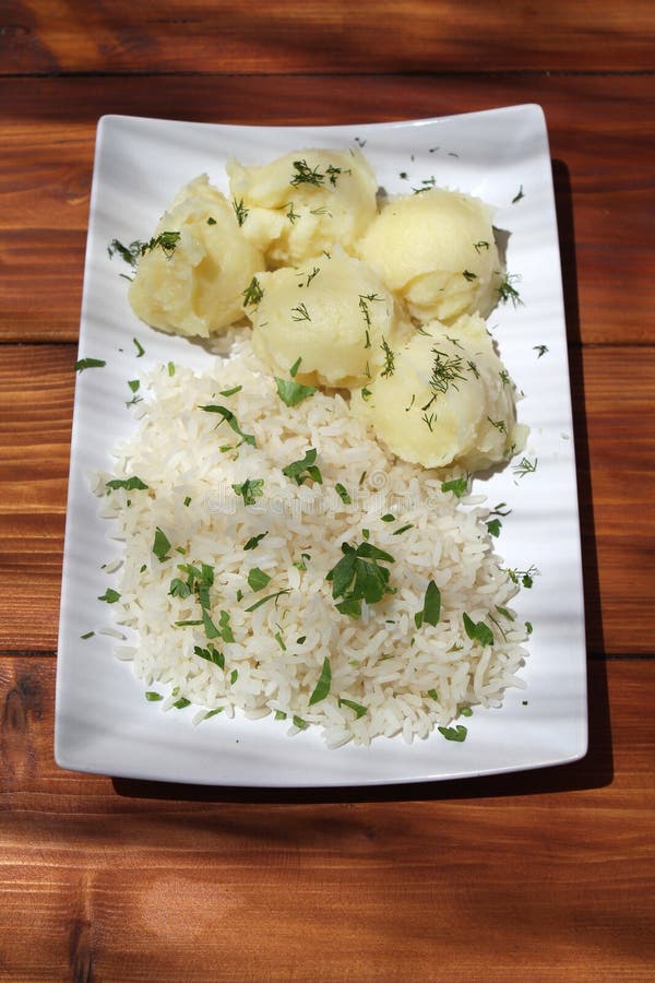 Plate of Boiled Rice and Mashed Potatos on a Table Stock Photo - Image ...