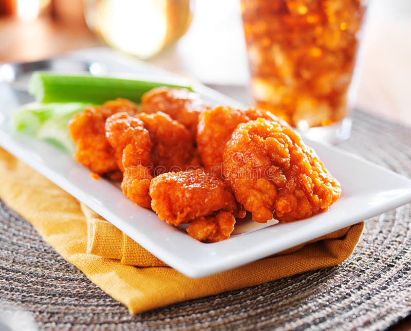 Plate of Boneless Buffalo Flavored Chicken Wings Stock Photo - Image of ...