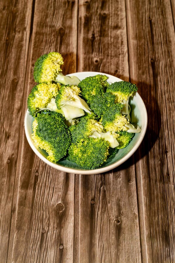 Plate with Broccoli on a Wooden Table Stock Photo - Image of plate ...