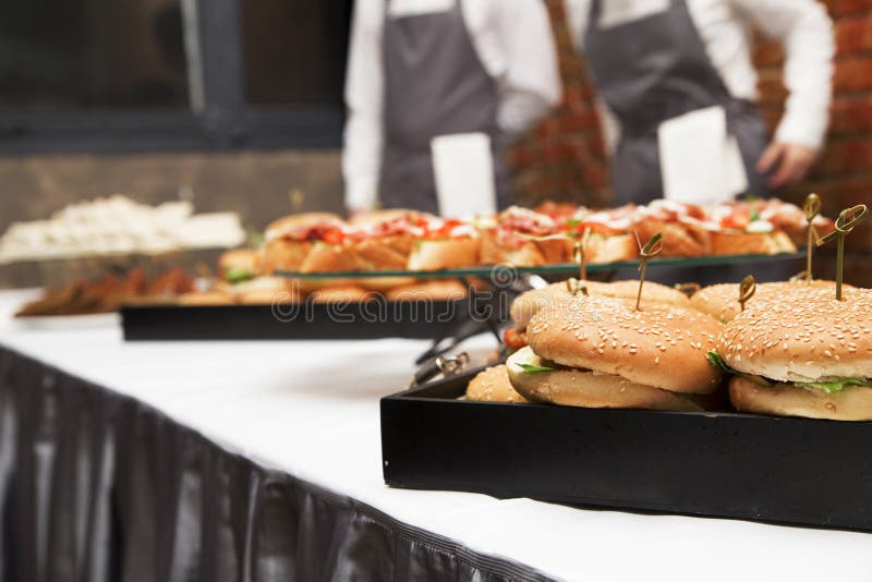 A Plate of Burgers on a Buffet Table Stock Image - Image of buffet ...