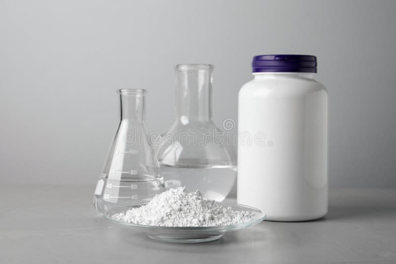 Plate with Calcium Carbonate Powder, Jar and Laboratory Glassware on ...