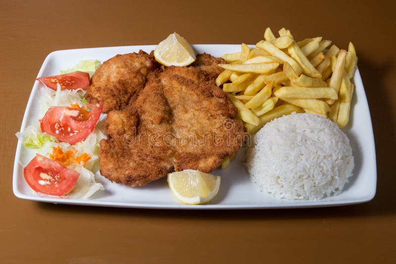 Plate of chicken schnitzel stock image. Image of pork - 267221049