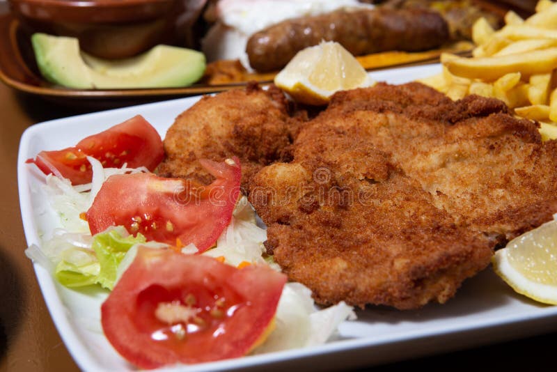 Plate of chicken schnitzel stock image. Image of organic - 267221163