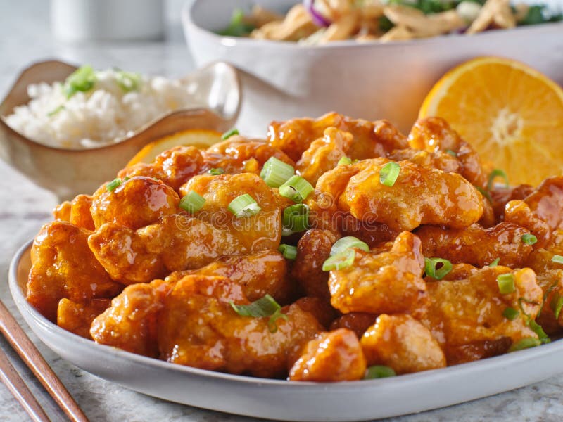 Plate of Chinese Orange Chicken with Green Onion Garnish Stock Image ...
