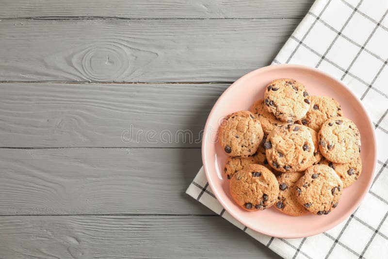 Plate with Chocolate Chip Cookies and Space for Text on Wooden Table ...