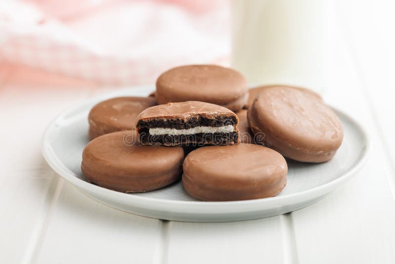 Plate of Chocolate Covered Cookies and Glass of Milk Stock Image ...