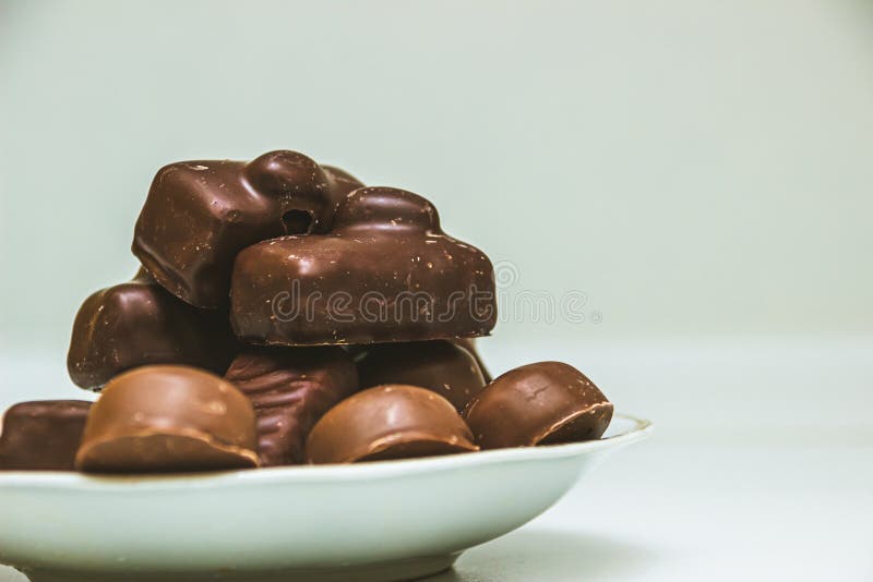 Plate with chocolates stock photo. Image of delicious - 184471412