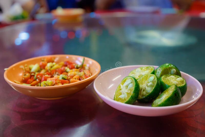 Plate of Chopped Chilli and Plate of Cut Limes Stock Image - Image of ...