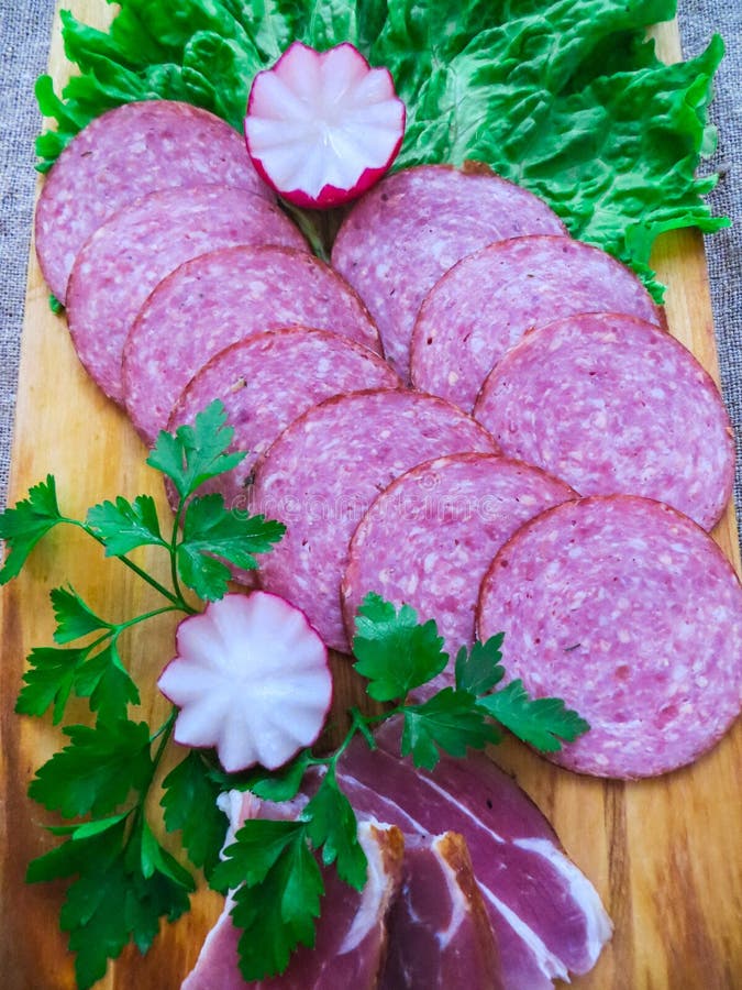 A Plate with Chopped Pieces of Sausage and Meat Stock Photo - Image of ...