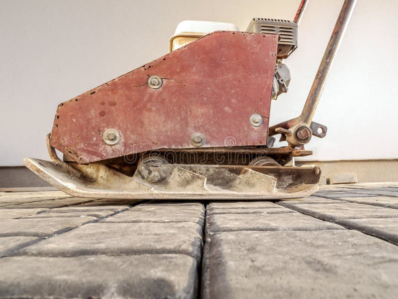 Plate Compactor on Paving Blocks Stock Photo - Image of compacting ...