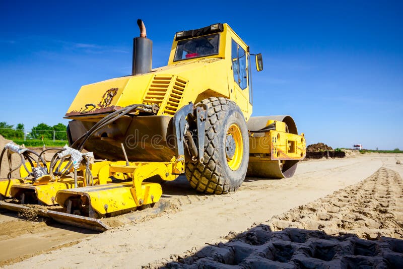 Plate Compactor is Mounted on Road Roller To Compact Soil at ...