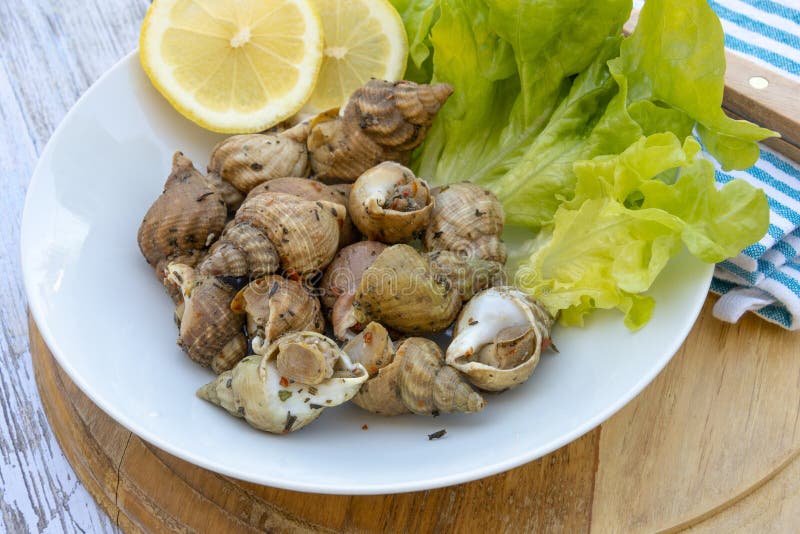 Plate of Cooked Whelks on a Table Stock Image - Image of table, seafood ...