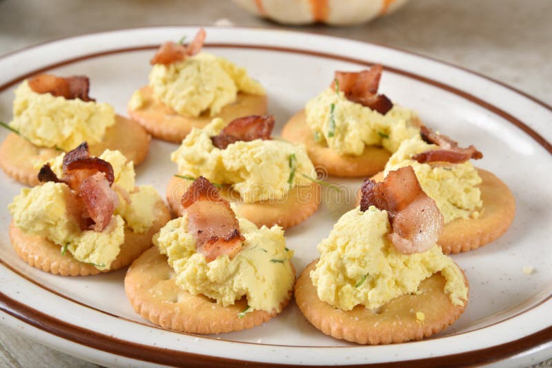 Crackers with Deviled Egg and Bacon Stock Photo - Image of bacon, eggs ...