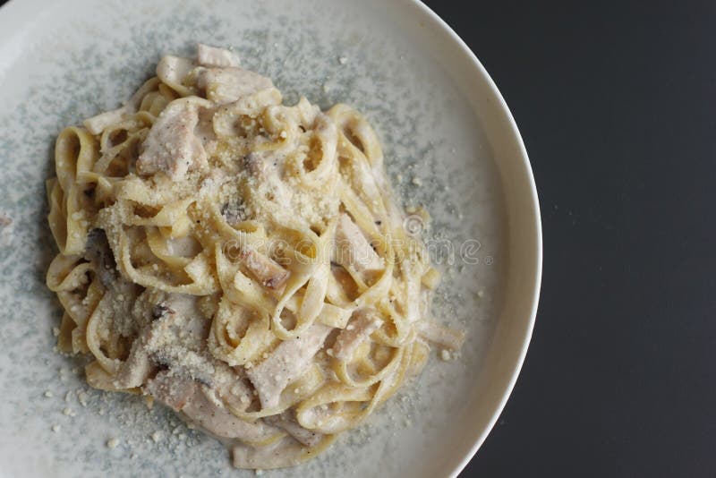 Plate of Cream and Chicken Pasta on Table Stock Image - Image of ...