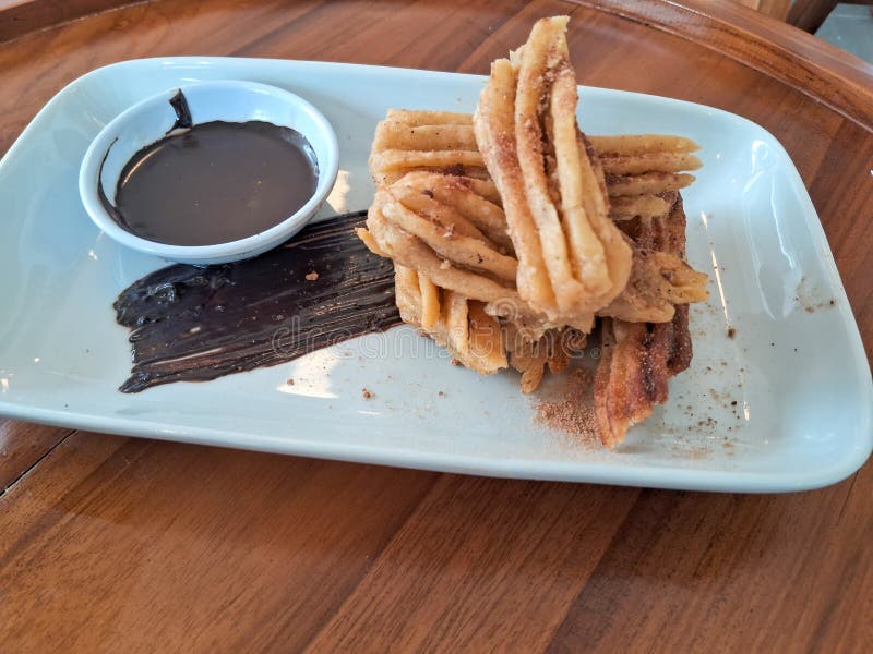 A Plate of Curros Plus Chocolate Stock Image - Image of plus, chocolate ...