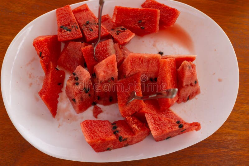Plate of Deep Red Watermelon Chunks on White Plate Stock Image - Image ...