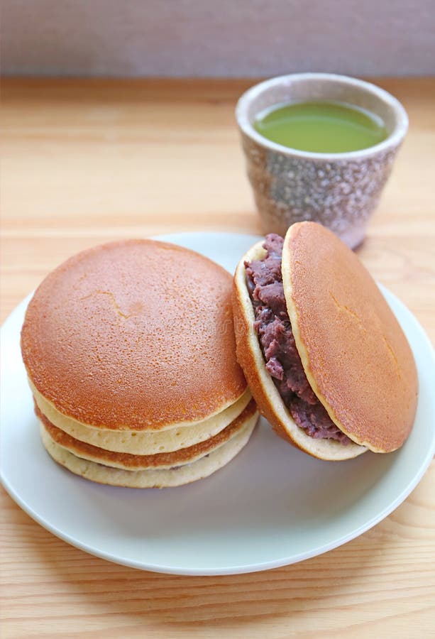 A Plate of Delectable Dorayaki with a Cup of Hot Matcha Green Tea Stock ...