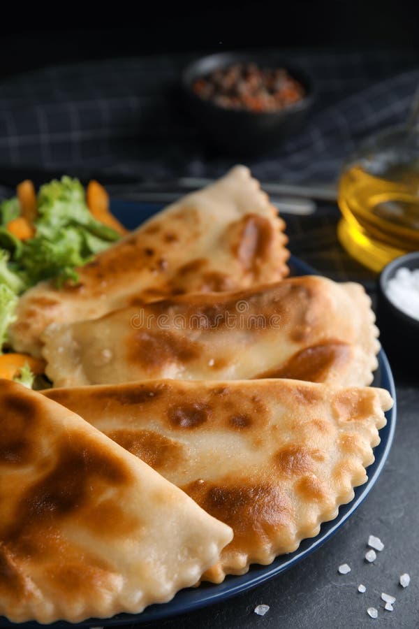 Plate with Delicious Fried Chebureki on Black Table Stock Photo - Image ...