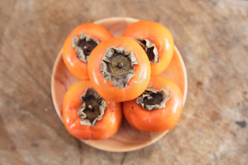 A Plate of Delicious Red Persimmons Stock Photo - Image of sweets ...