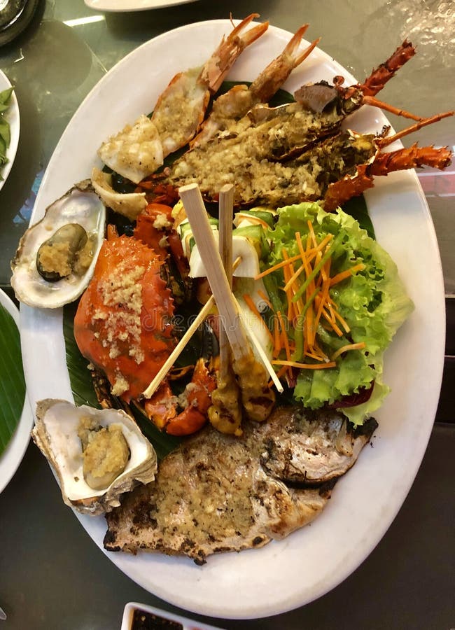 Plate of delicious seafood stock photo. Image of seafood - 142923676
