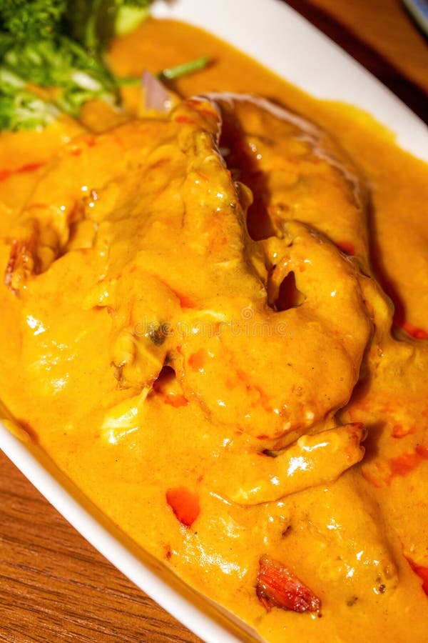 A Plate of Delicious Thai Yellow Curry Braised Prawns Stock Photo ...
