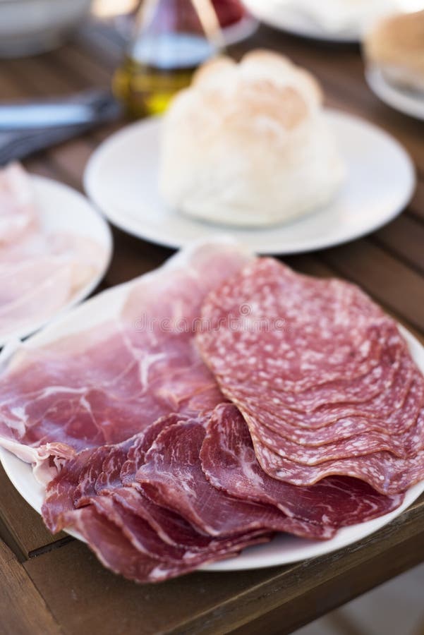 Plate with Different Cold Cuts on a Table Stock Image - Image of ...