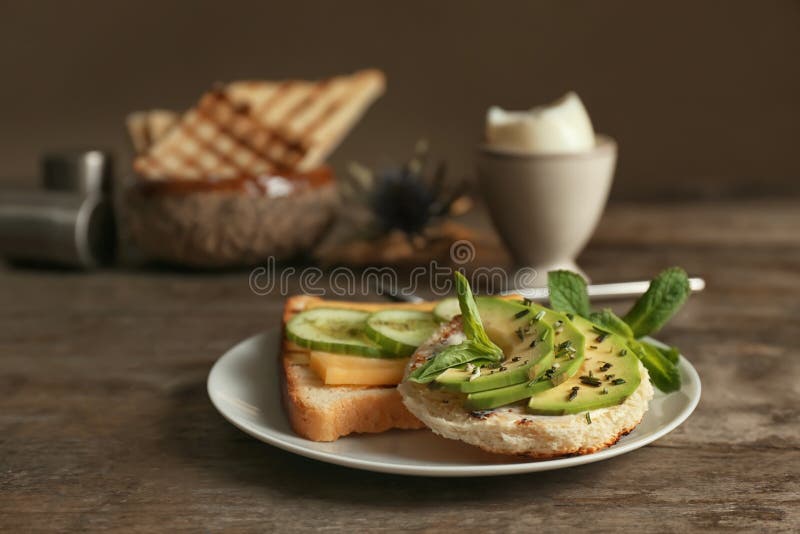 Plate with Different Delicious Toasts on Table Stock Photo - Image of ...