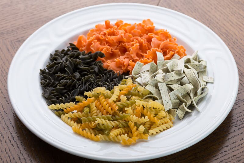 Plate with Different Kinds of Dry Pasta Stock Photo - Image of table ...