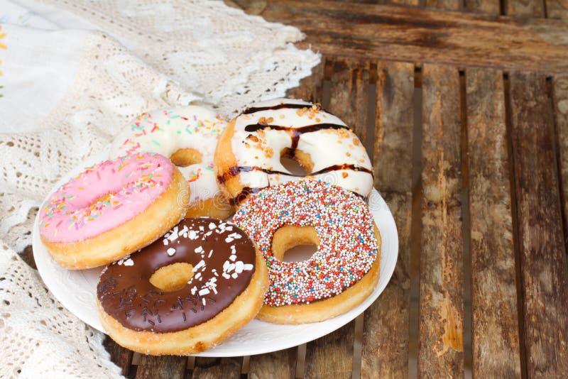 Plate of donuts on table stock image. Image of closeup - 32736921