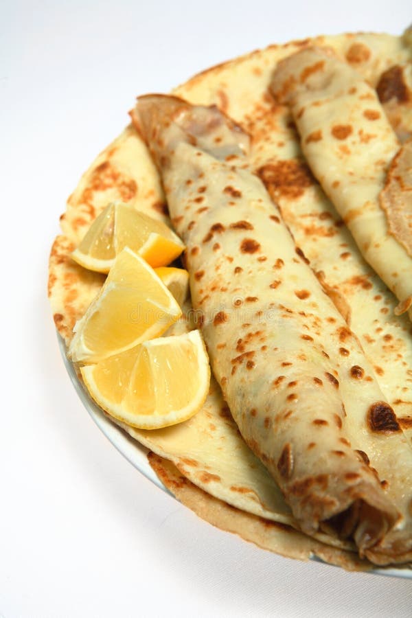 Plate of English Pancake Crepes with Lemon Wedges Stock Photo - Image ...