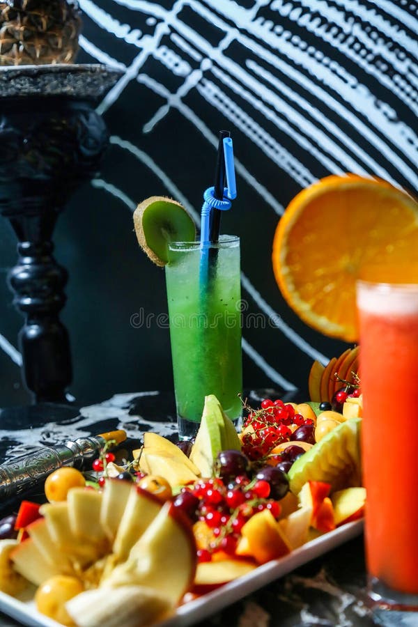 Fresh Fruit Plate with Refreshing Drink on Table Stock Photo - Image of ...