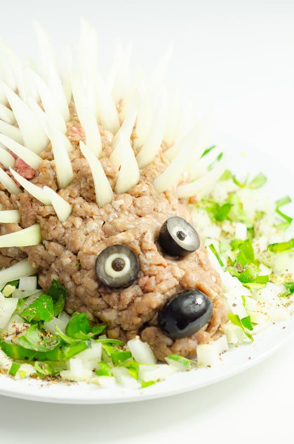 A Plate of Food with a Face Made of Meat and Vegetables Stock Photo ...