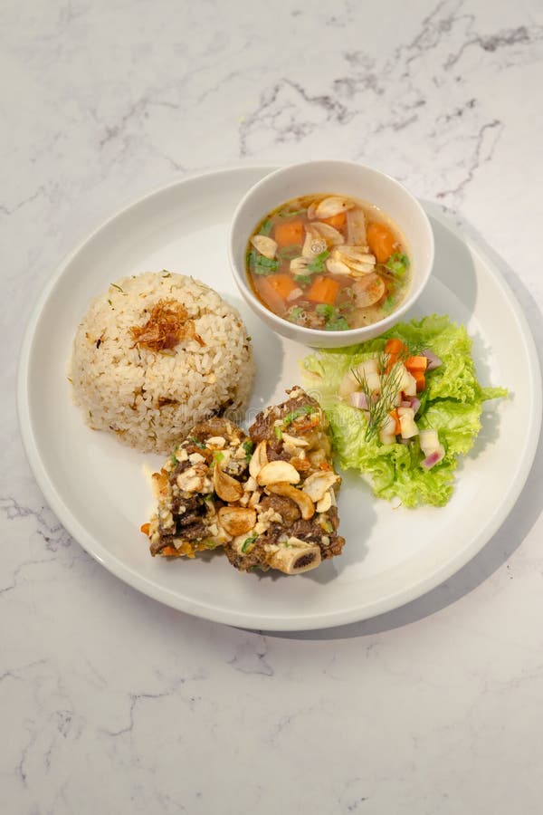 A Plate of Food with Rice, Vegetables, and Meat Stock Photo - Image of ...