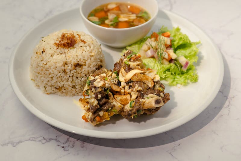 A Plate of Food with Rice, Vegetables, and Meat Stock Photo - Image of ...