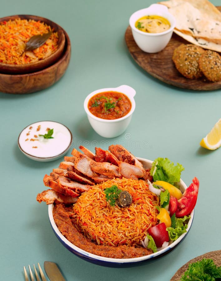 Plate of Freshly Cooked Meat and Rice on a Green Table Stock Photo ...